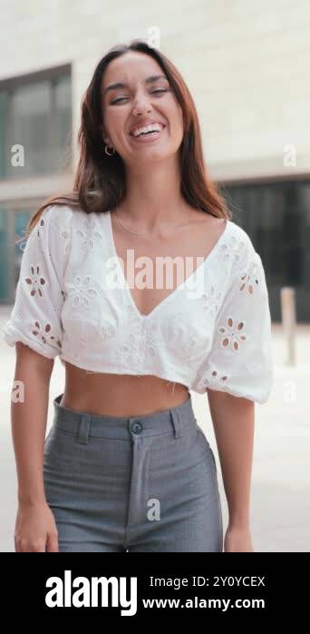 Vertical close up individual portrait of a hispanic girl smiling ...