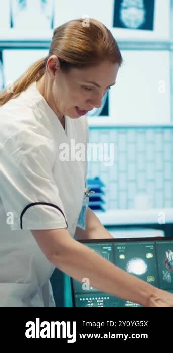 Vertical Video Team of doctors review electrocardiogram test results at ...