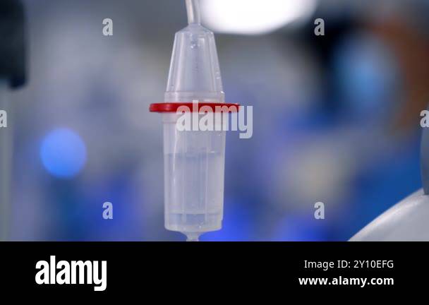 Container of drop counter with medicine dripping inside. Iv drip close ...