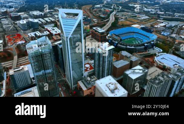 Skyscrapers with mirror facades, multi-storied buildings and stadium ...