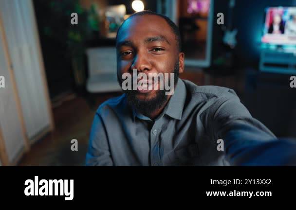 Smiling influencer using mobile phone to do live broadcast for ...