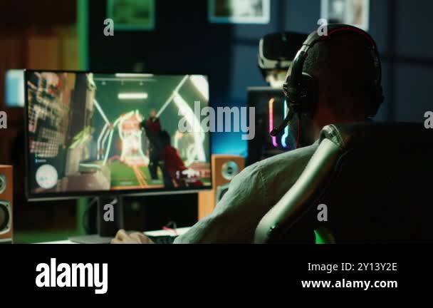 Man face palming in front of computer display while playing videogames ...