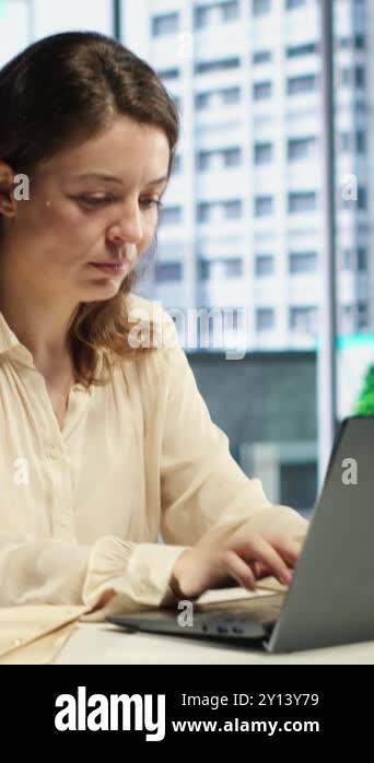 Vertical Video Portrait of determined female leader focuses on ...