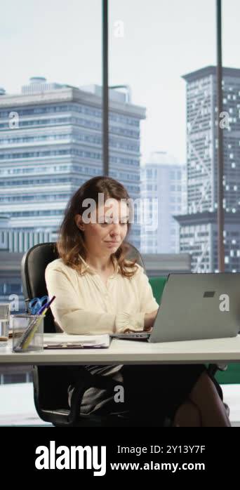 Vertical Video Ambitious businesswoman demonstrating her leadership ...