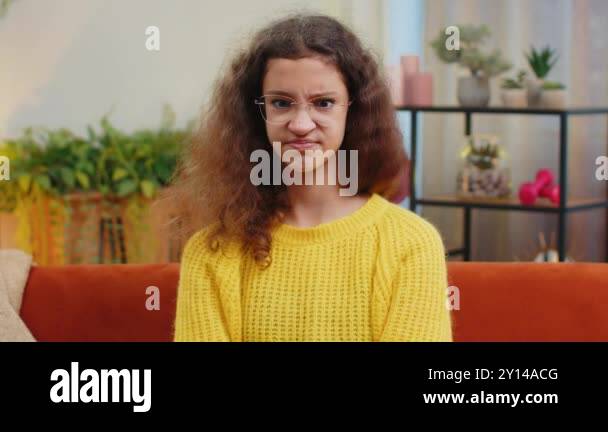 Dislike. Upset child girl showing thumbs down sign gesture, expressing discontent, disapproval ...