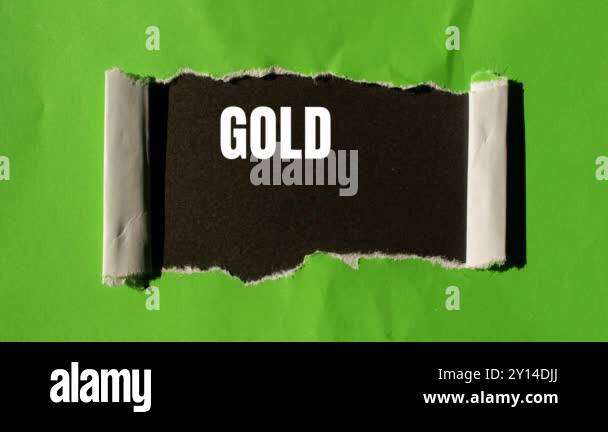 Golden rule message writing on ripped torn green paper with black background. Conceptual golden ...