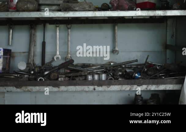 dirty messy tools in a small mechanical workshop in a village in ...