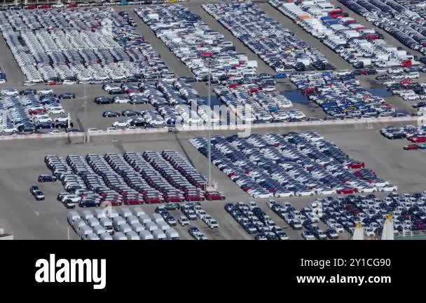 KOPER PORT, SLOVENIA - 2024, March 3: AERIAL: Imported cars are neatly ...