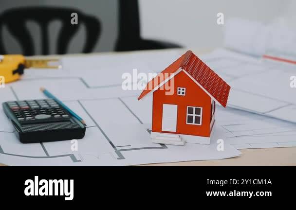 house plan with model of house model and calculator Stock Video Footage ...