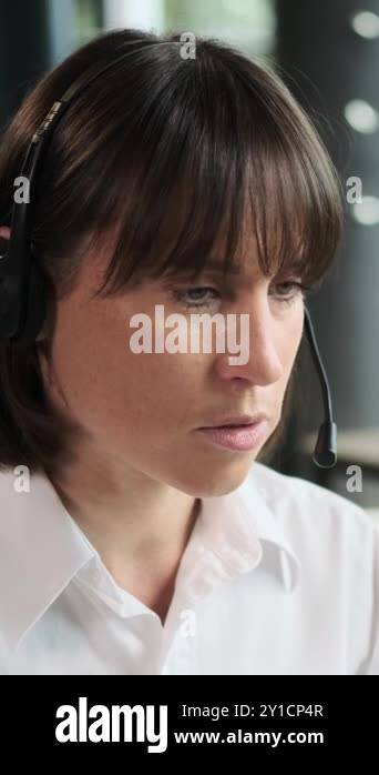 Concentrated female middle aged Caucasian online support agent wearing ...