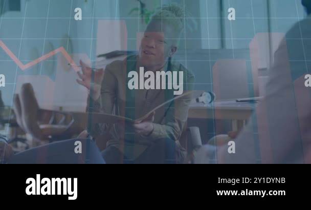 Businessman discussing documents with colleague, financial graph ...