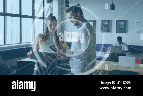 Digital interface animation over business people discussing work in ...