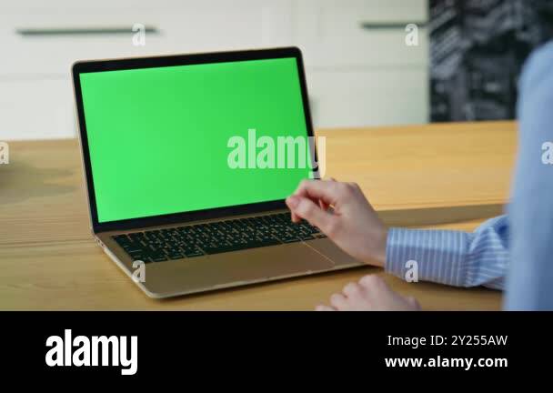 Online student studying at mockup laptop in apartment closeup. Unknown ...