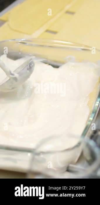 Beef lasagna step by step recipe. Layer of cream cheese. Close up video ...