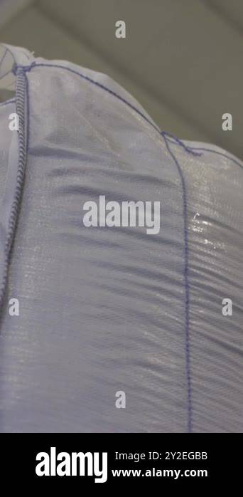 Warehouse for storage of fertilizers in bags. stack of big bag contain ...