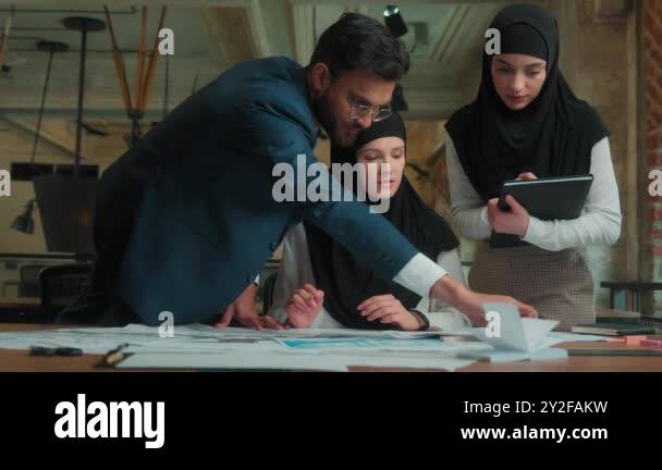 Arabian business man muslim women in hijab teamwork architecture ...