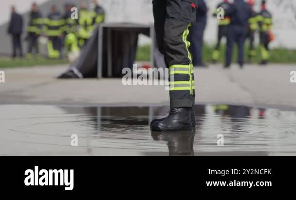 reflective scene captures a firefighter heading into a dangerous ...