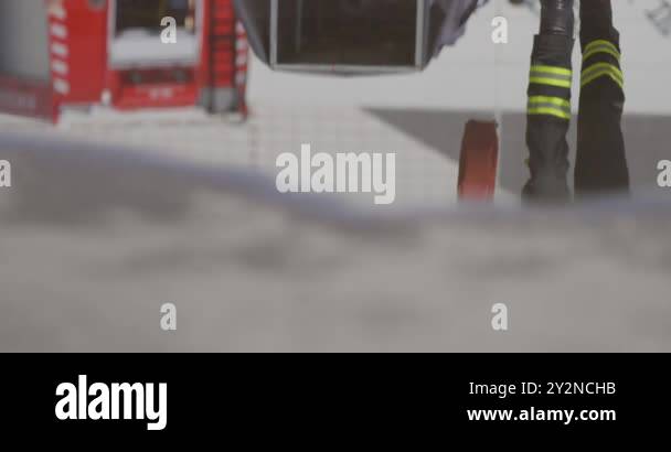 reflective scene captures a firefighter heading into a dangerous ...