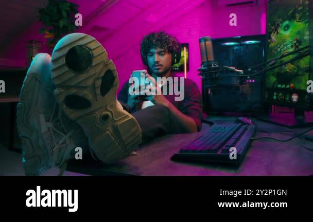 Indian American man gamer gambler computer game technology mobile phone ...