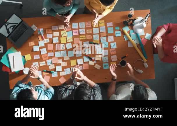 Top view of smart project manager talking and explain idea and clapping ...