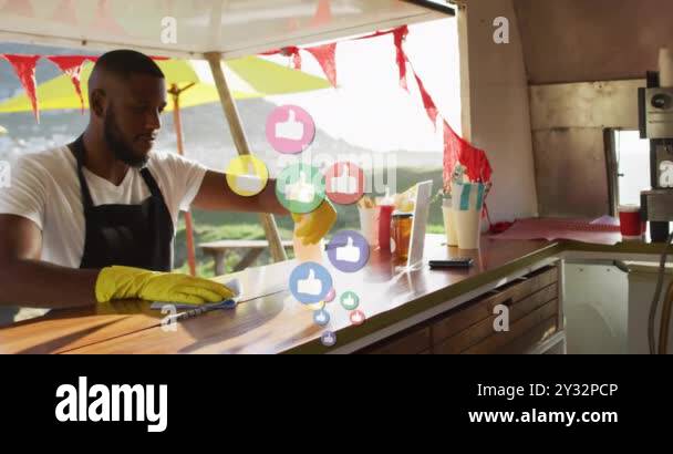 Cleaning counter, man surrounded by floating thumbs-up icons in ...