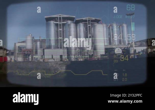 Data processing animation over industrial facility with silos ...