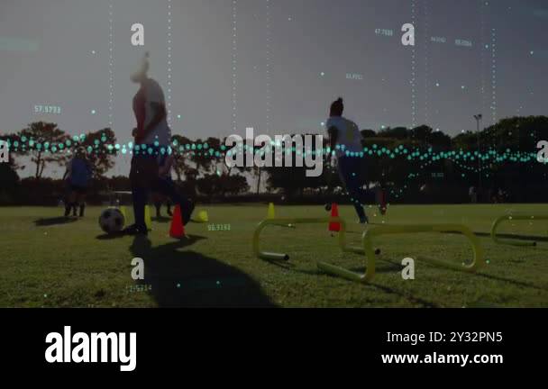 Data points and graphs animation over athletes training on soccer field ...