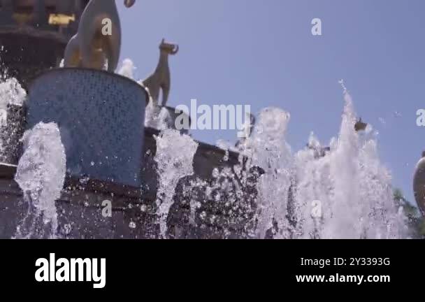 Fountain spewing refreshing jets creates vivid scene against clear blue ...