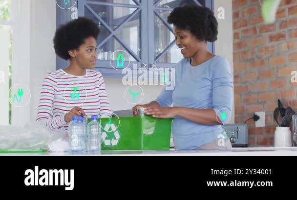 Recycling symbols animation over two women sorting plastic bottles in ...