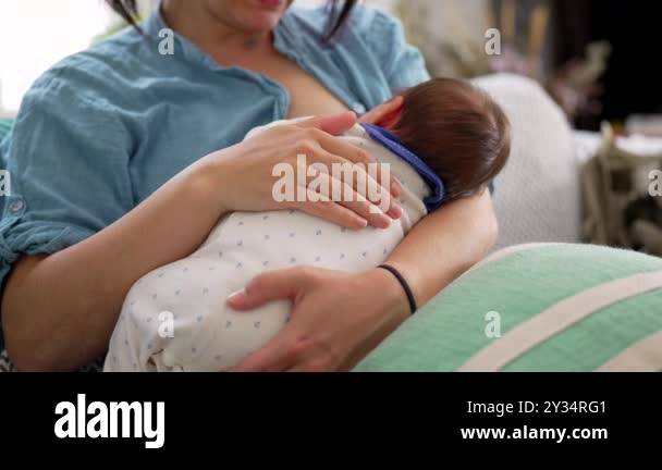 Mother breastfeeding newborn baby, with focus on nurturing and intimate ...
