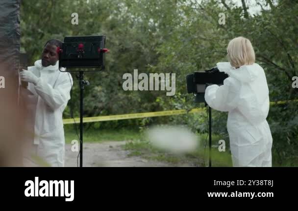 Crime scene suits Stock Videos & Footage - HD and 4K Video Clips - Alamy