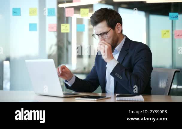 Overworked businessman in a formal suit suffering from eye strain and ...