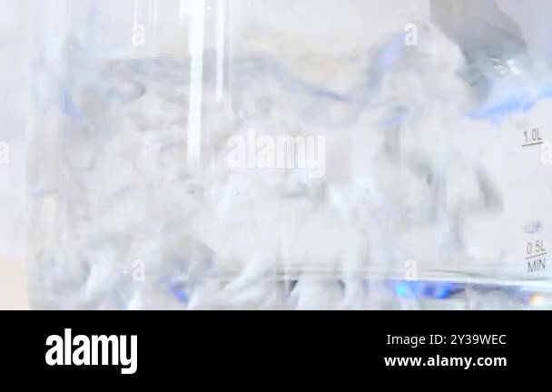 Close up view of boiling water boiling water in a transparent dish or ...