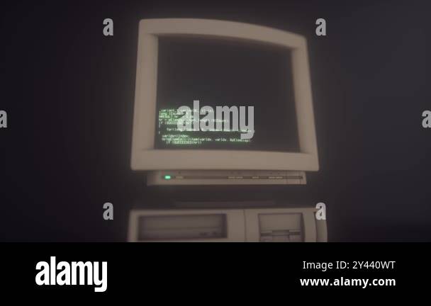 Retro personal computer or PC with source code running on screen ...