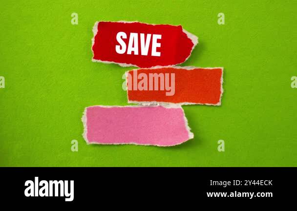 Save the date message writing on ripped colorful torn paper pieces on green background ...