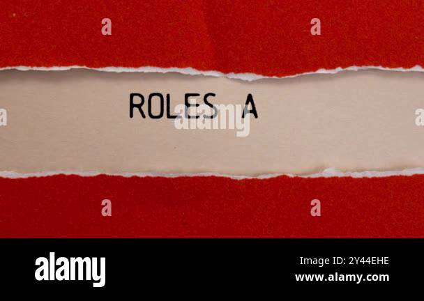 Roles and responsibilities message writing on ripped red torn paper on ...