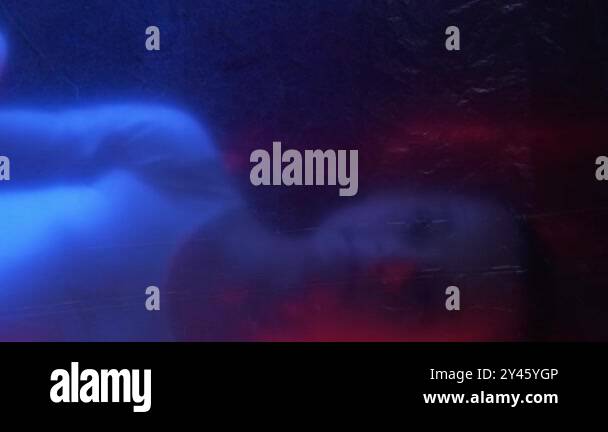 Vertical video. Sad girl. Blur silhouette. Neon portrait in dark red ...