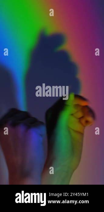 Vertical video. Hand dance. Rainbow colors. LGBT culture. Female palms ...