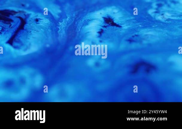 Paint splash. Fluid spill. Defocused blue color emulsion texture ...