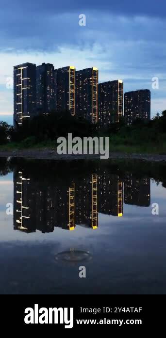 Asia big city with high rise building illuminated by light at twilight ...