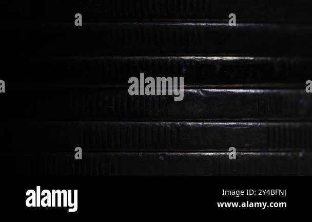 Stack of brown coins in close-up, texture of old coins, dark background ...
