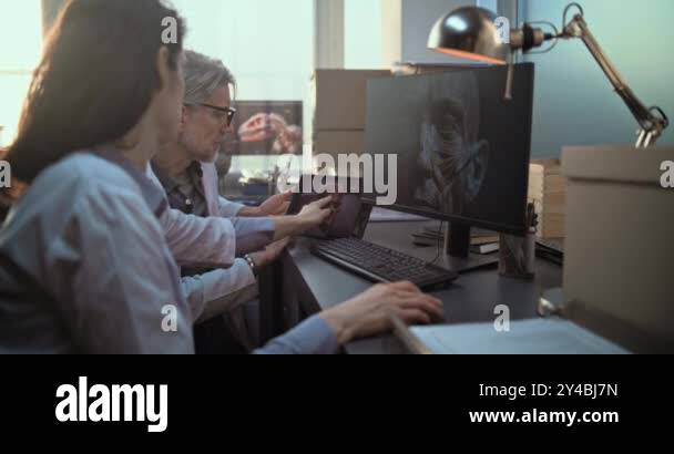 Two diverse scientists discuss 3D visualization of ancient human head ...