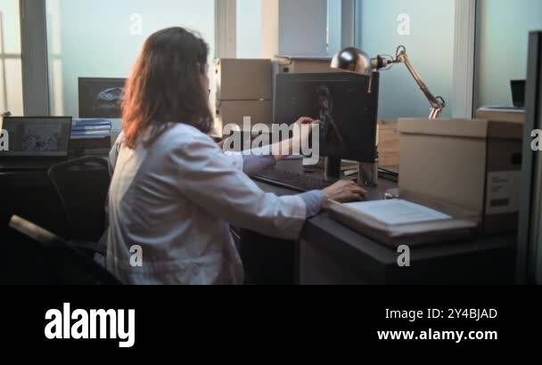 Male and female scientists discuss three dimensional model of head ...