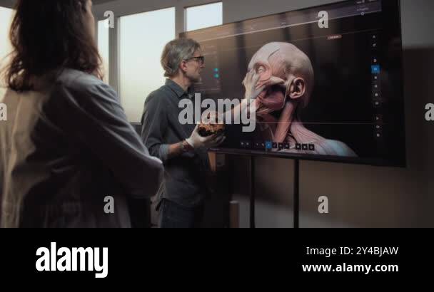 Male and female scientists or archaeologists talk, study fossil skull ...