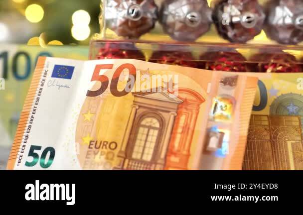Christmas expenses and spending.Euro banknotes and Christmas toys in ...