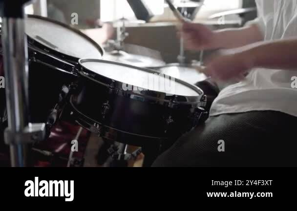 hand of Unrecognized player performing on a drum set Close up of ...