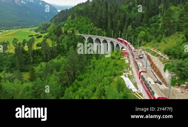 Railway scenic route in Switzerland. Express red swiss train in Swiss ...