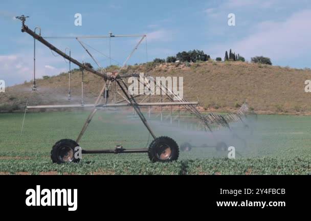 A center pivot irrigation system efficiently waters a diverse field of ...