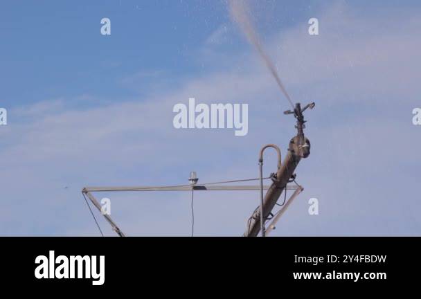 A pressurized irrigation system efficiently waters crops under a clear ...