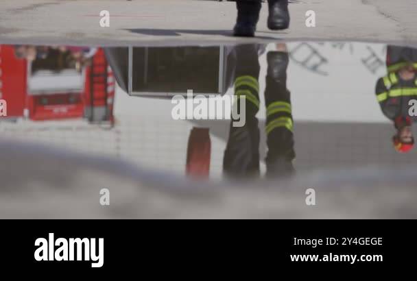 reflective scene captures a firefighter heading into a dangerous ...